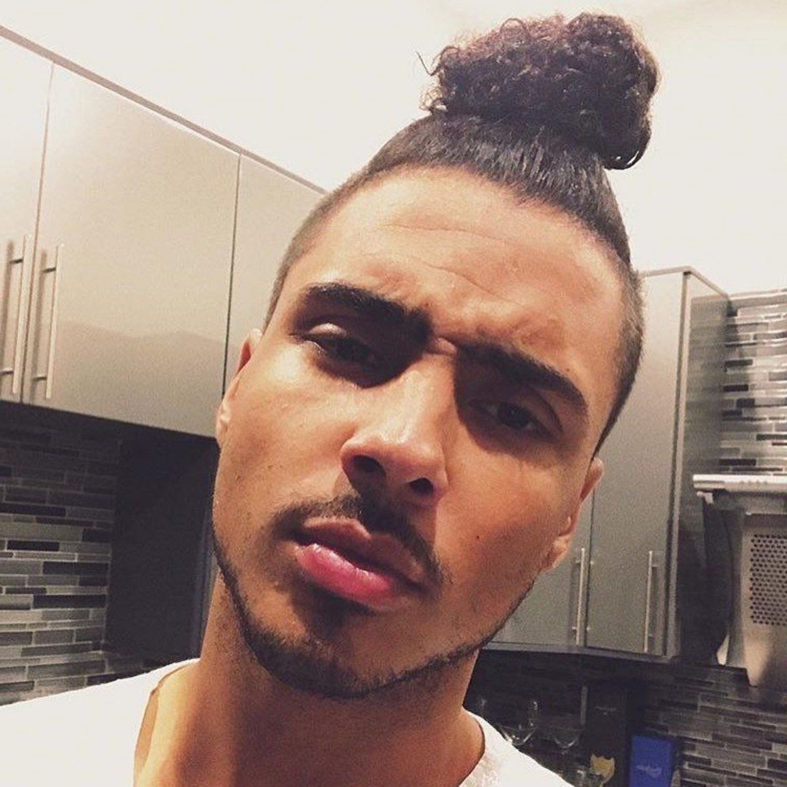 57 Famous Men with a Fashionable Male Bun Style